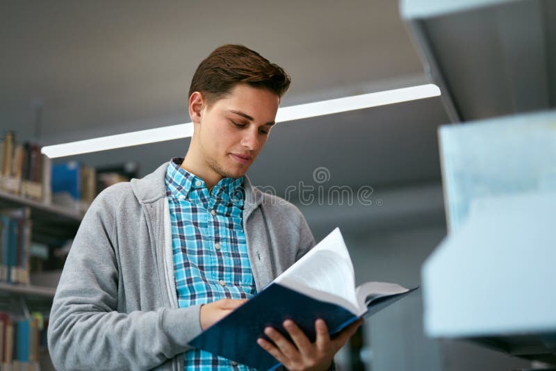 Student Reading Book in College Library Stock Image - Image of research ...