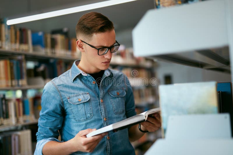 Student Reading Book in College Library Stock Photo - Image of read ...