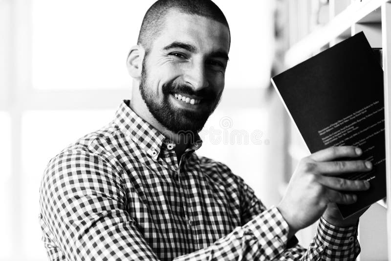Student Reading from Book in a Library Stock Image - Image of education ...