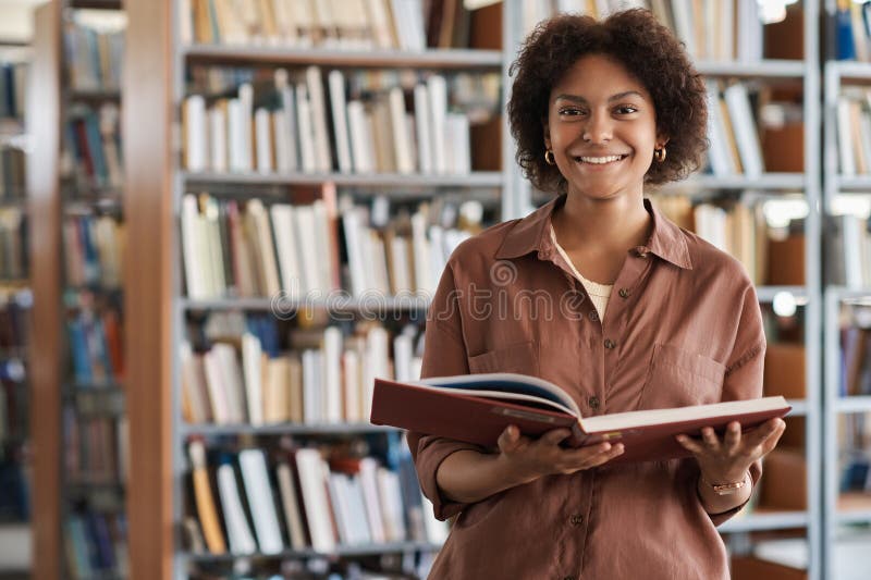 Student Reading Book in Library Stock Image - Image of portrait, shelf ...