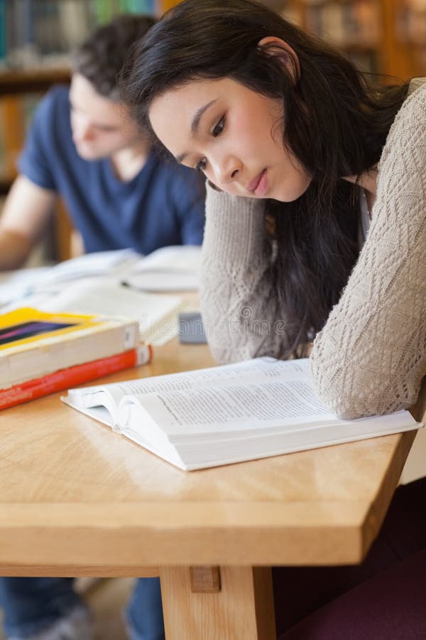 Student Reading a Book in a Library Stock Photo - Image of studying ...