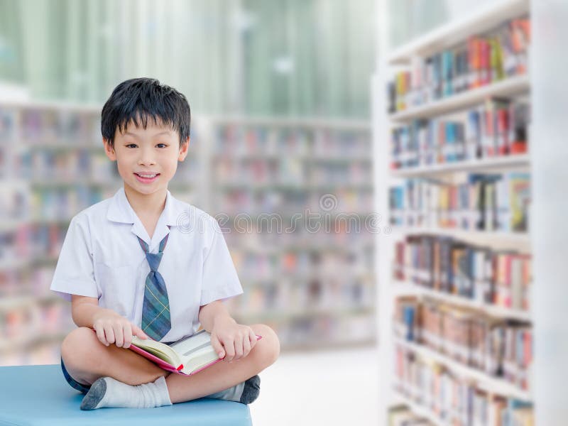 Student Reading Book in School Library Stock Photo - Image of future ...