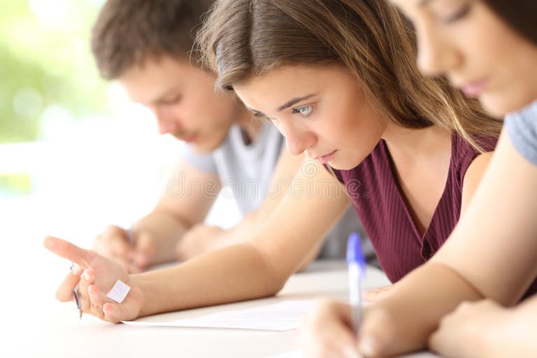 Student Reading a Cheating Sheet during an Exam Stock Image - Image of ...