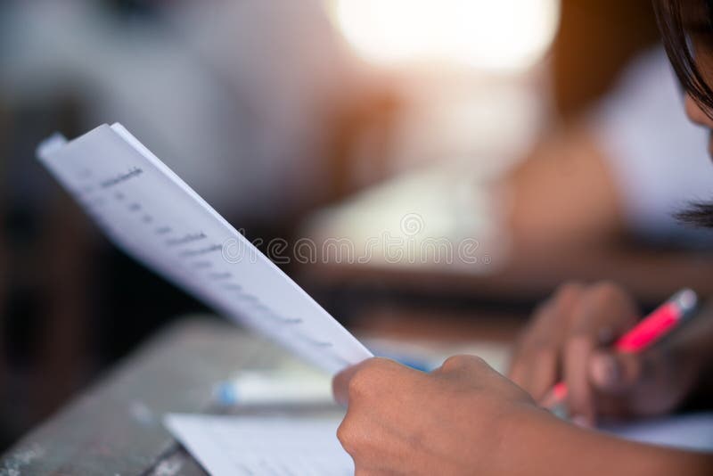 Student Reading and Doing Test or Exam in Classroom of School with ...