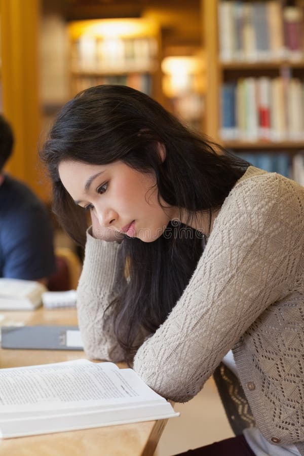 Student Reading in a Library Stock Image - Image of dark, textbook ...