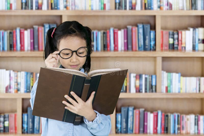 Student Reading Textbook in Library Stock Photo - Image of girl ...