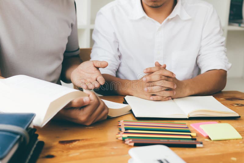 Student Reading Textbook for Test Together in Library Stock Image ...