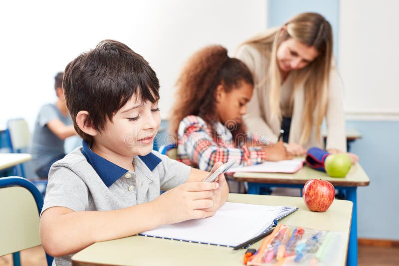 Student Reads or Writes Text Messages in Class Stock Photo - Image of ...