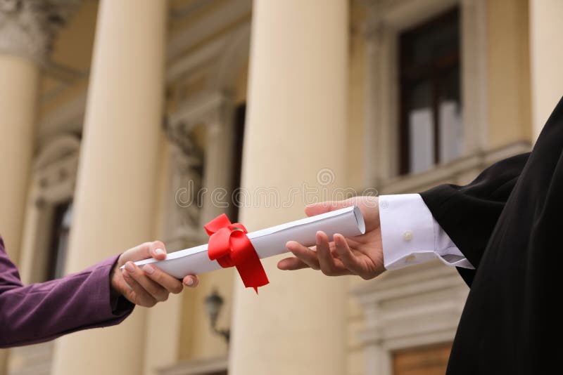 Student Receiving Diploma during Graduation Ceremony Outdoors, Closeup ...