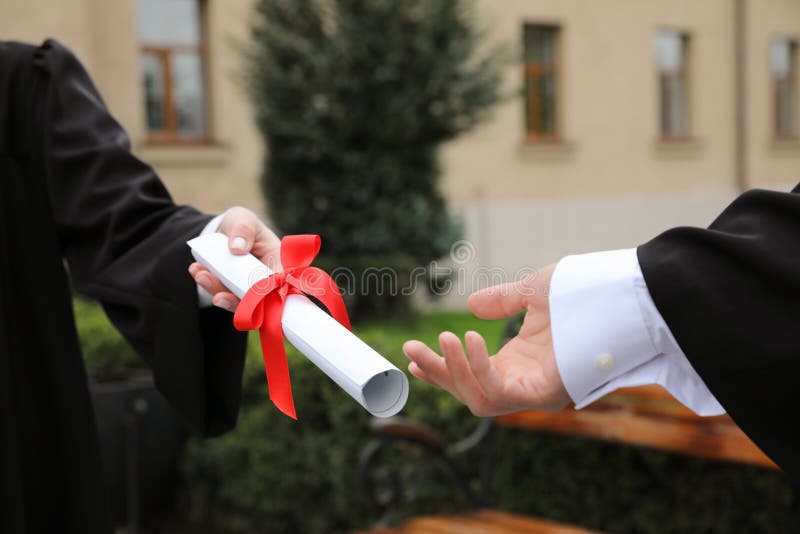 Student Receiving Diploma during Graduation Ceremony Outdoors, Closeup ...