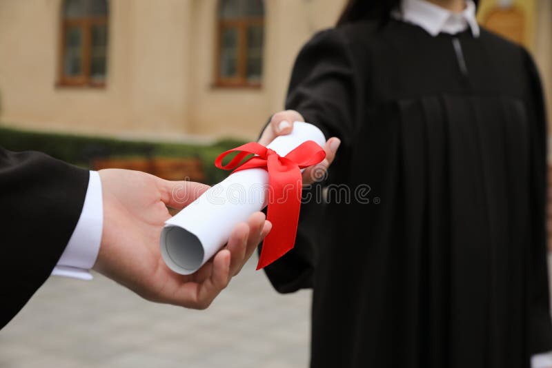 Student Receiving Diploma during Graduation Ceremony Outdoors, Closeup ...