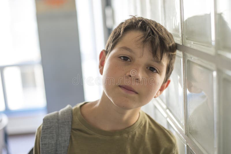 Student Resting on the School and Playing with a Mobile Phone Stock ...
