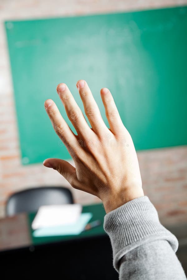 Student S Hand Against Greenboard in Classroom Stock Photo - Image of ...