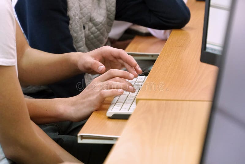 Student& X27;s Hands at the Computer Keyboard in Computer Classroom ...