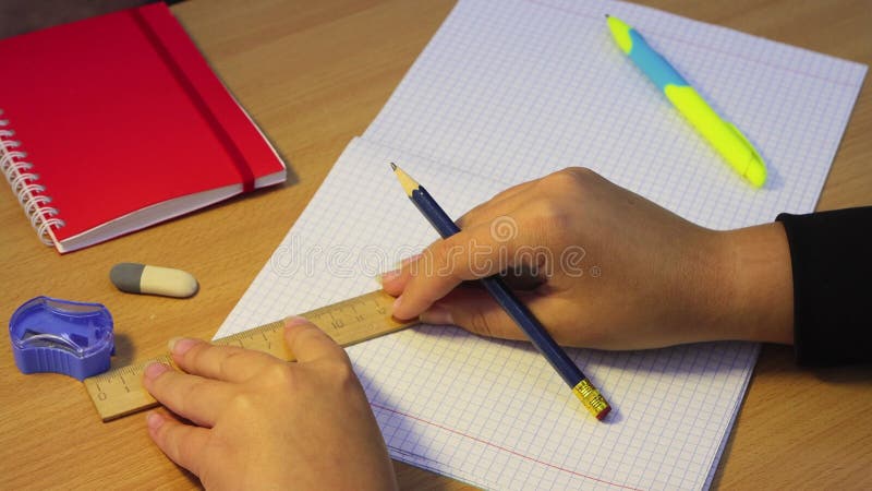 The Student S Hands Draw a Rectangle with a Pencil Using a Ruler, Close ...