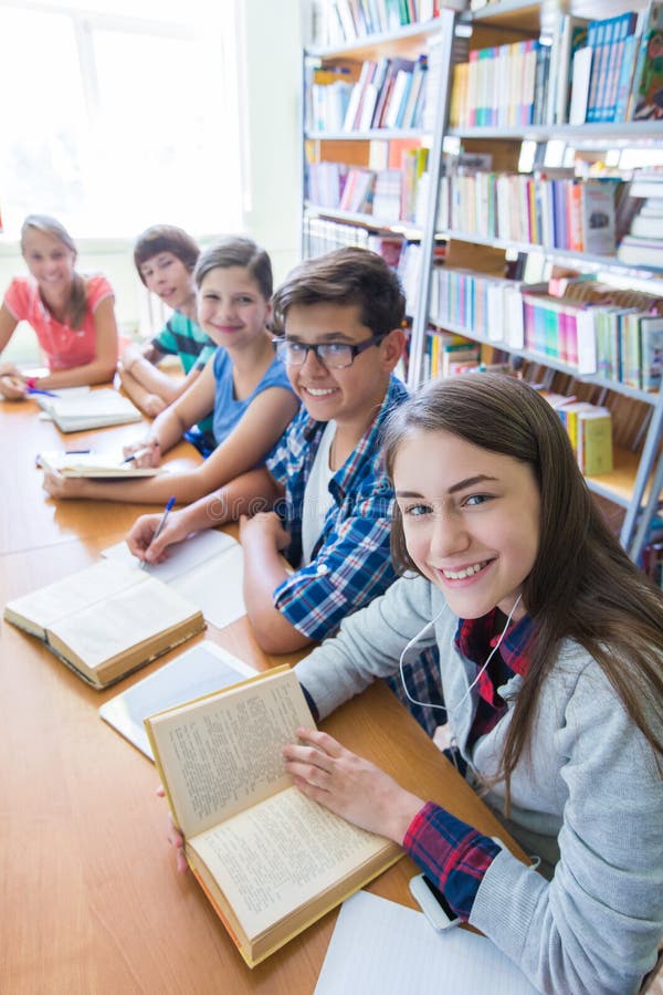 Teens in library stock image. Image of females, library - 98726705