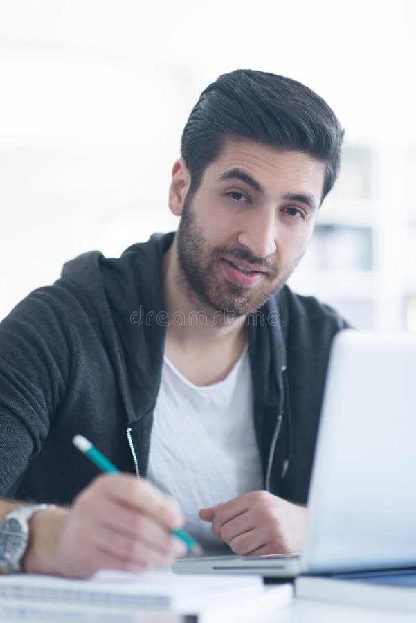Student in School Library Using Laptop for Research Stock Photo - Image ...