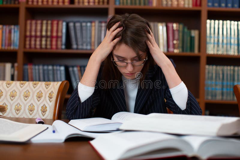 The Student is in Shock Holds on To the Head in Library. Stock Image ...