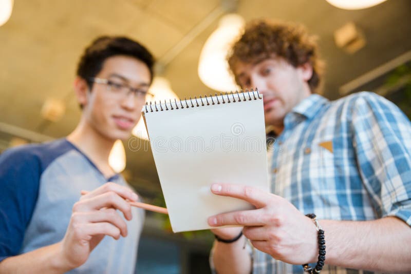 Student Showing His Notes To a Friend Stock Photo - Image of help ...