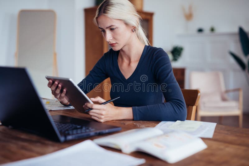 Student Sits at Desk with Tablet while Studying at Home Stock Image ...