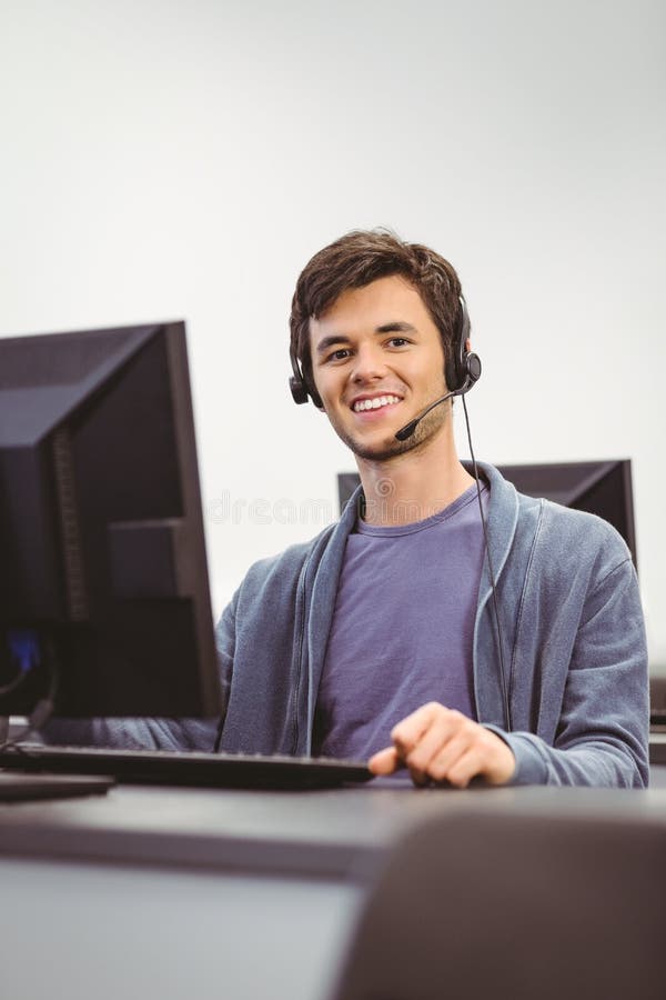 Student Sitting at the Computer Room Wearing Headset Stock Image ...