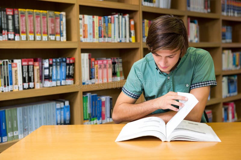 Student Sitting in Library Reading Stock Photo - Image of thoughtful ...