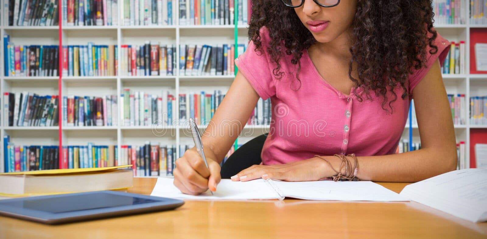 Female High School Student Working at Laptop in Library Stock Photo ...
