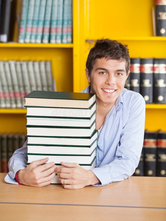 Student Sitting with Piled Books in University Stock Photo - Image of ...