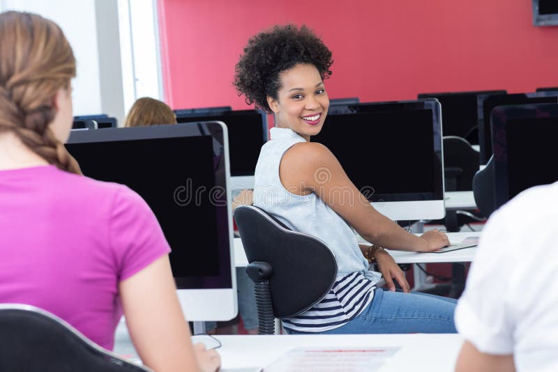 Student Smiling at Camera in Computer Class Stock Image - Image of ...