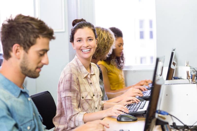 Student Smiling at Camera in Computer Class Stock Photo - Image of four ...