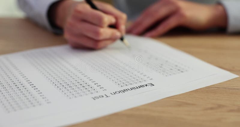 Student Solving Tests and Crossing Out Correct Answers with Pencil on ...