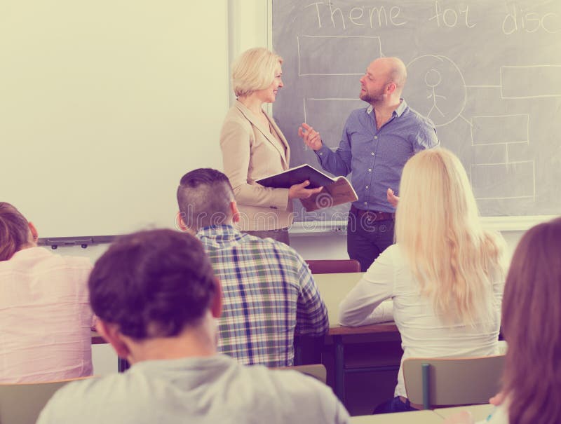 Student Speaking on Topic at Desk Stock Photo - Image of learning ...
