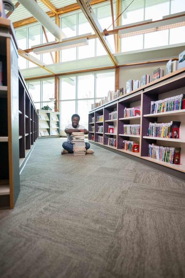 Student with Stack of Books in Library Stock Image - Image of bookshelf ...