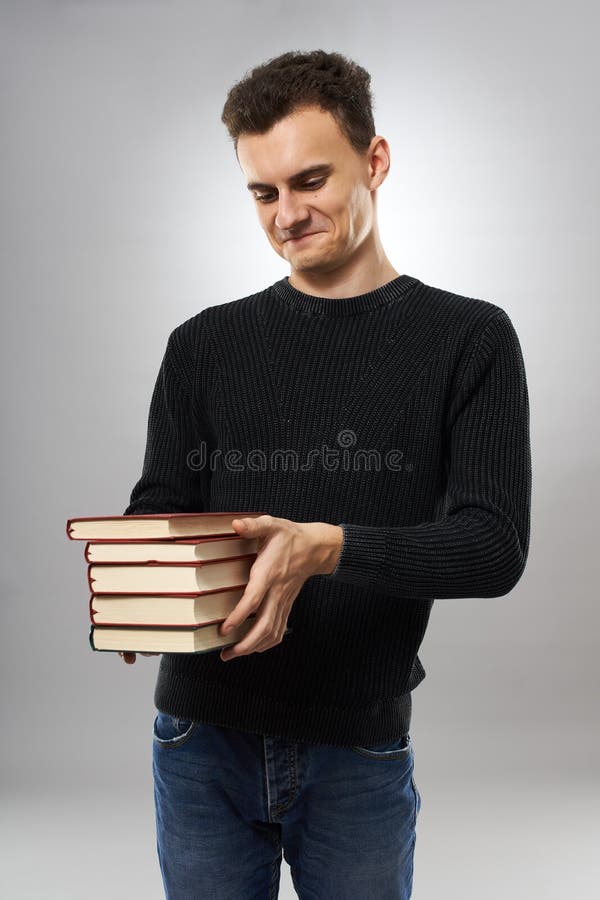 Unhappy Student with a Stack of Books Stock Photo - Image of lesson ...