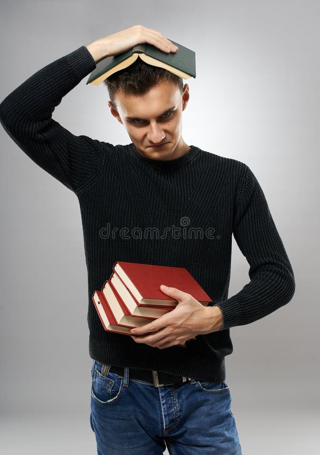 Unhappy Student with a Stack of Books Stock Photo - Image of lesson ...