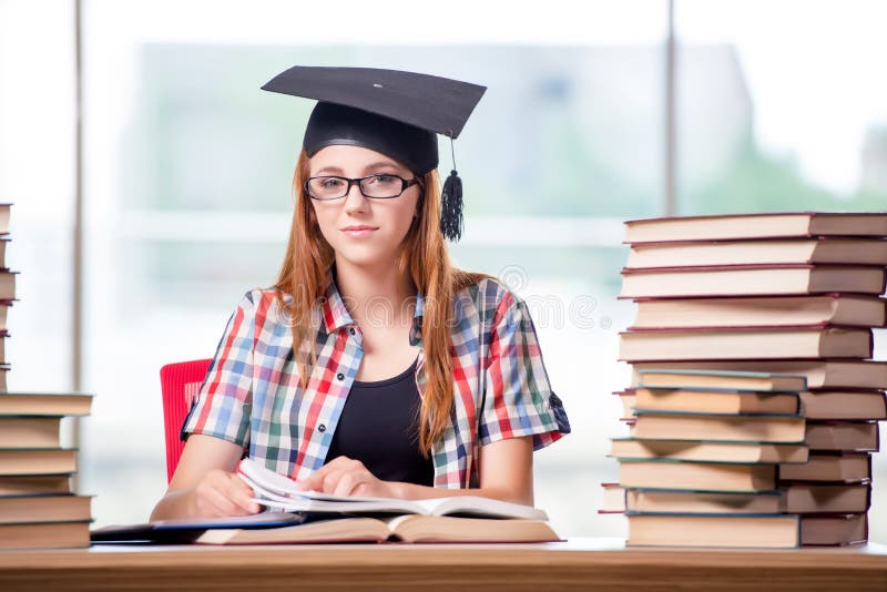 The Student with Stacks of Books Preparing for Exams Stock Photo ...