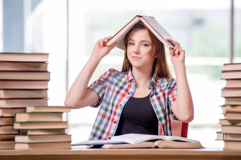 The Student with Stacks of Books Preparing for Exams Stock Photo ...
