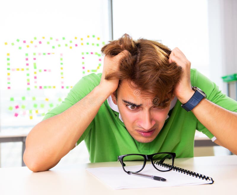Student Struggling at the Exam in Classroom Stock Image - Image of book ...