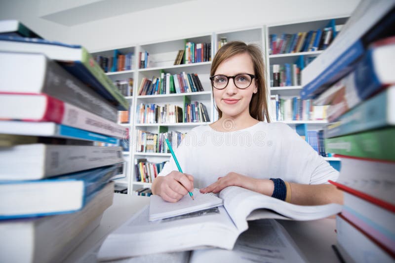 Student study in library stock photo. Image of bookshelf - 71575796