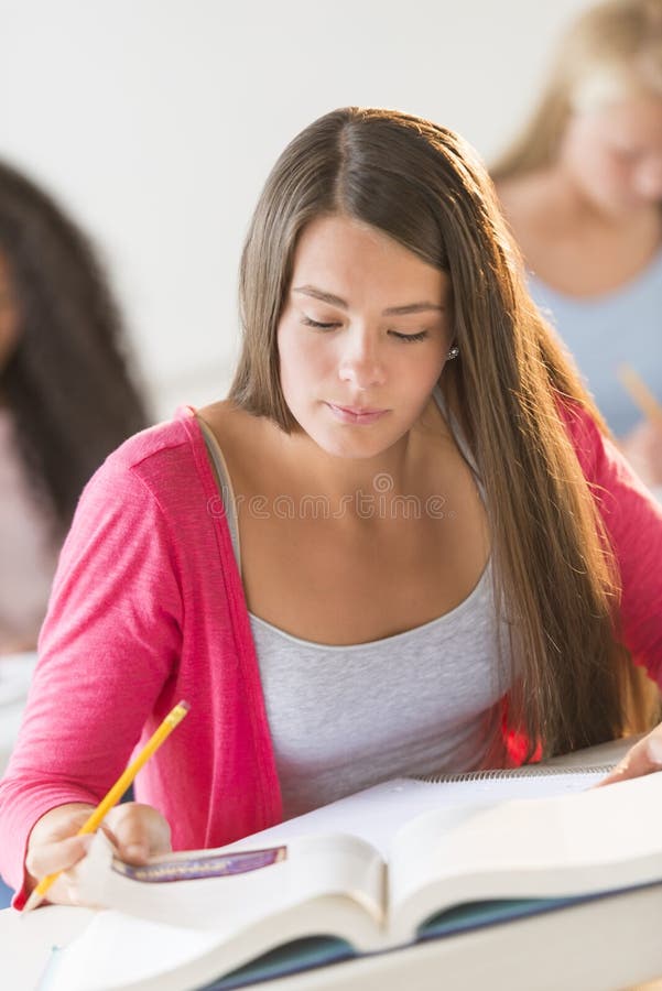 Student Studying at Desk in Classroom Stock Image - Image of ...