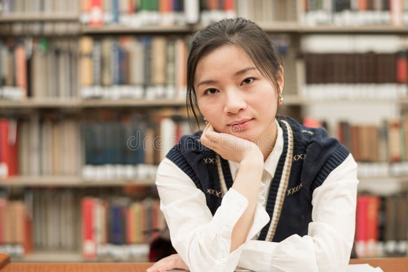 Student Studying at a Desk in Library Stock Image - Image of cover ...