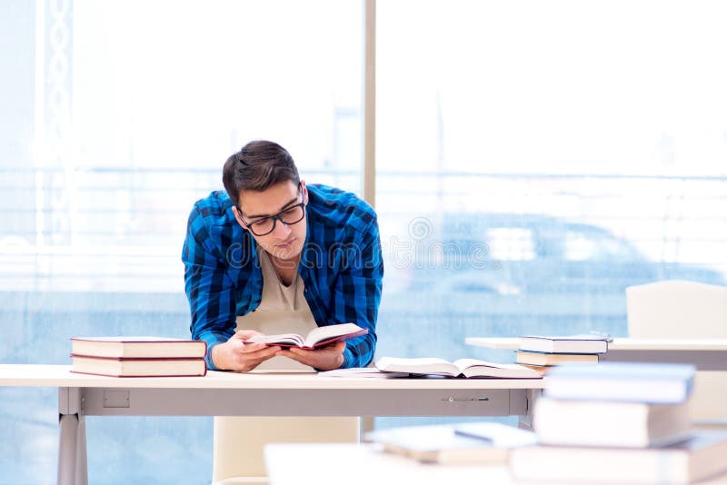 Student Studying in the Empty Library with Book Preparing for Ex Stock ...