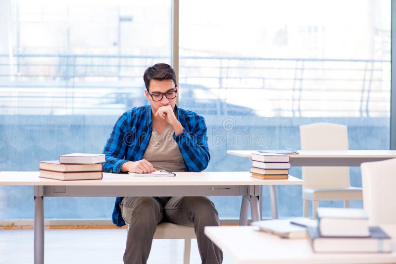 Student Studying in the Empty Library with Book Preparing for Ex Stock ...
