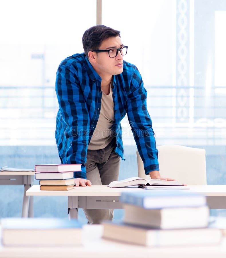 Student Studying in the Empty Library with Book Preparing for Ex Stock ...