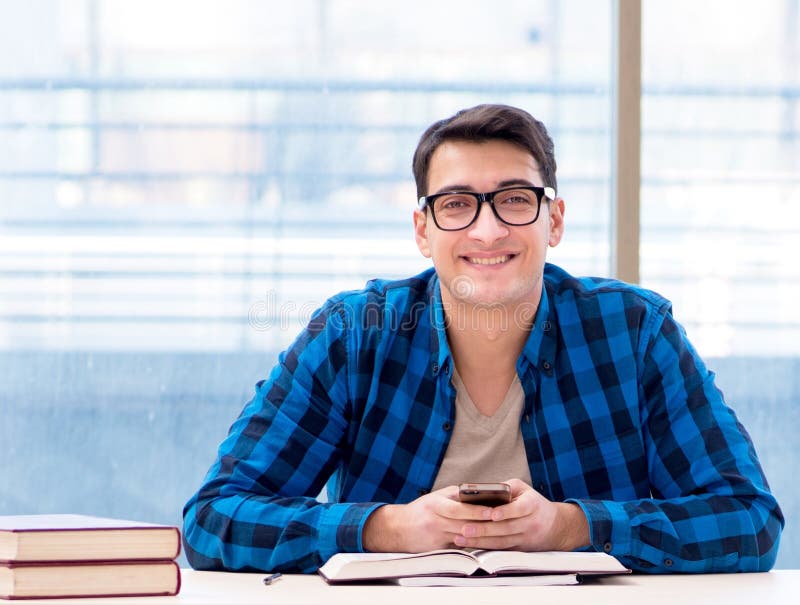 Student Studying in the Empty Library with Book Preparing for Ex Stock ...
