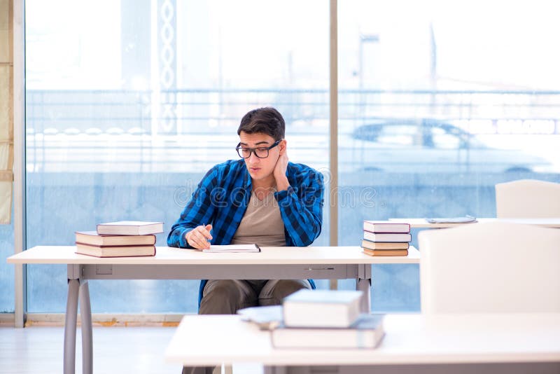 Student Studying in the Empty Library with Book Preparing for Ex Stock ...