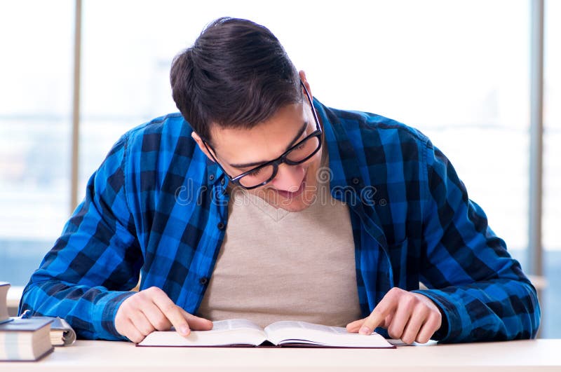 Student Studying in the Empty Library with Book Preparing for Ex Stock ...