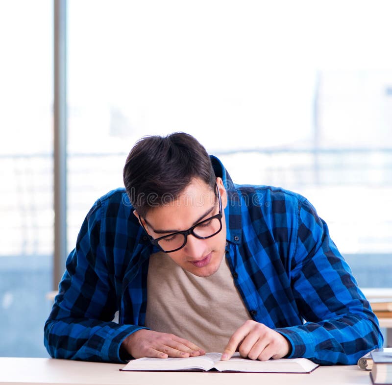 Student Studying in the Empty Library with Book Preparing for Ex Stock ...