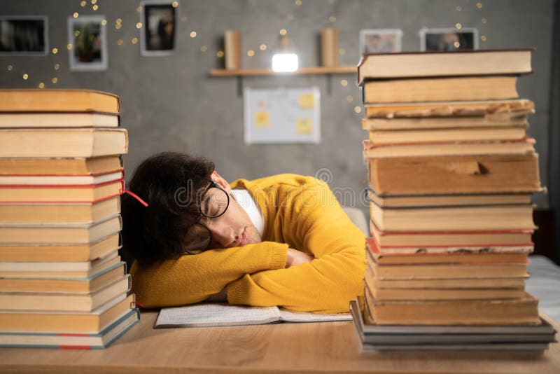 Student Studying Hard Exam and Sleeping between Books in Library. Stock ...