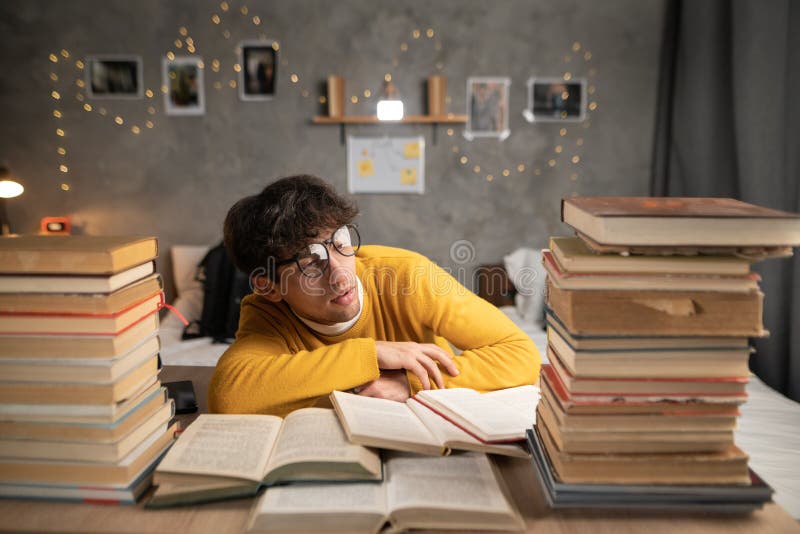 Student Studying Hard Exam and Sleeping at Table between Books in ...
